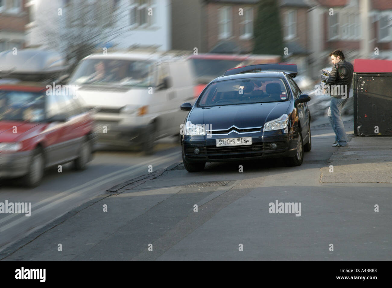 car parked on the pavement causing obstruction Stock Photo - Alamy