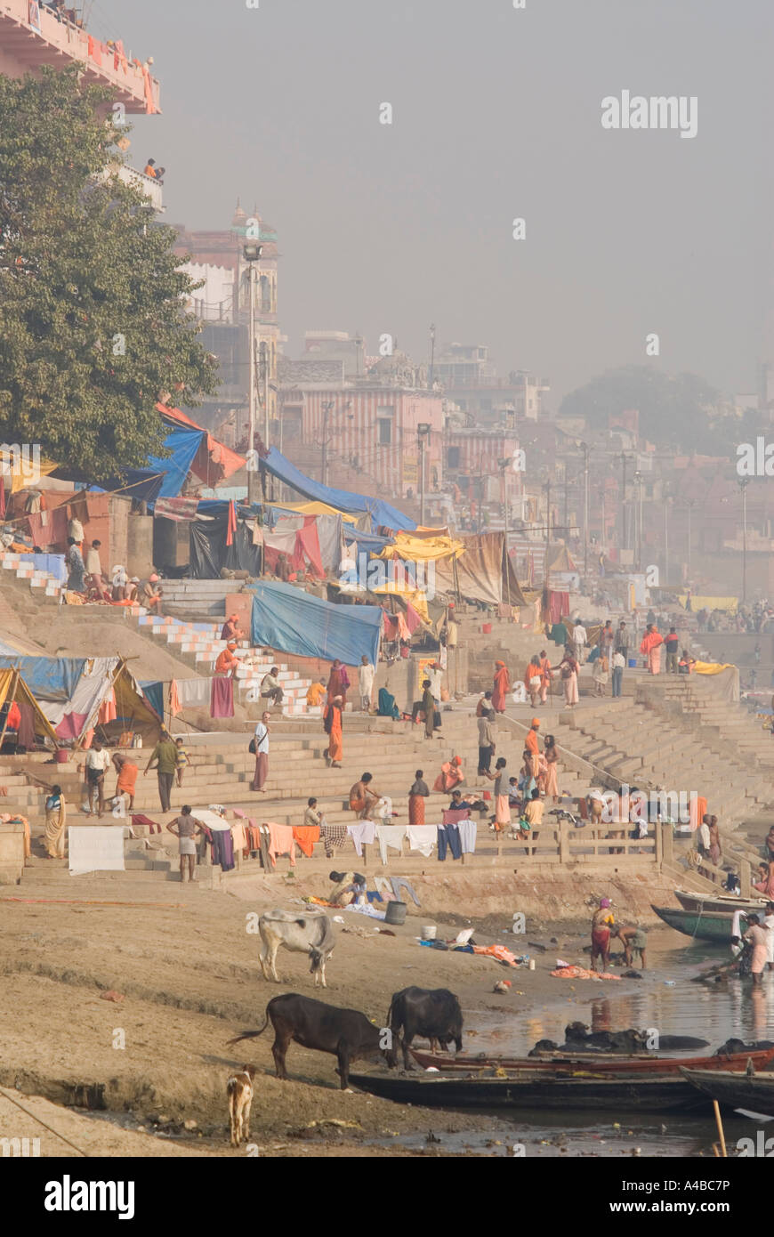 Stock image of boats and bathers along the ghats and steps of the River ...