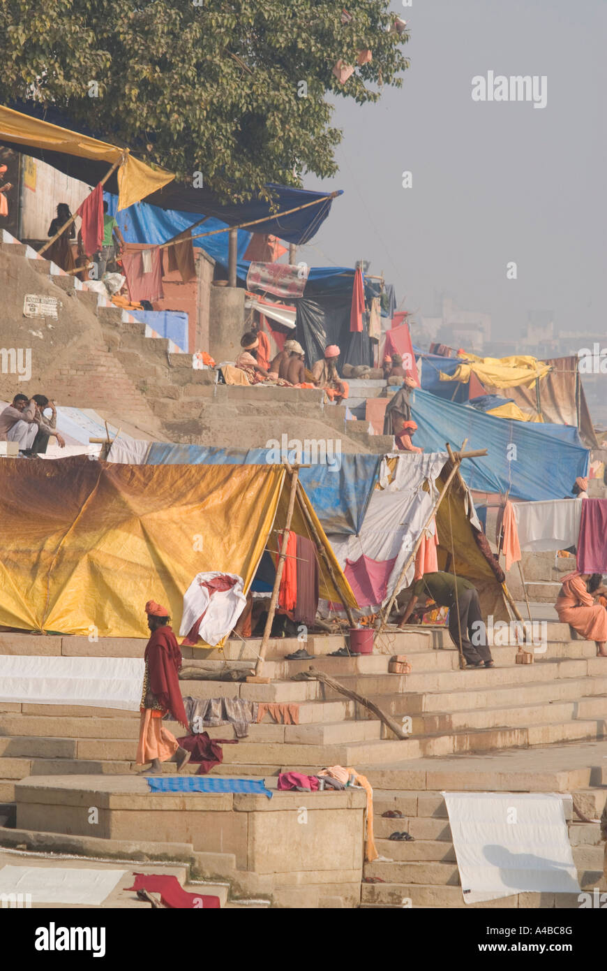 Stock image of boats and bathers along the ghats and steps of the River ...
