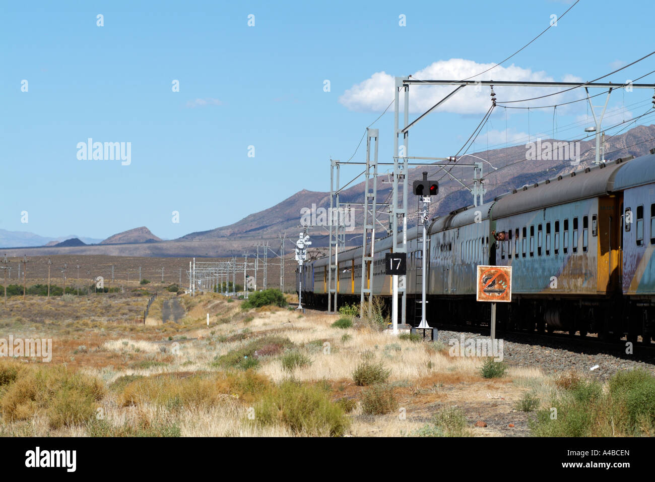Electric powered railway train departing Matjiesfontein in the Karoo ...