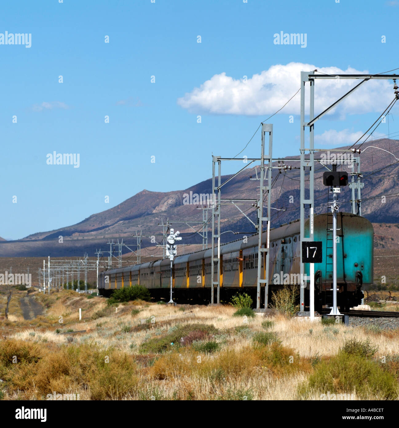 Electric powered railway train departing Matjiesfontein in the Karoo ...