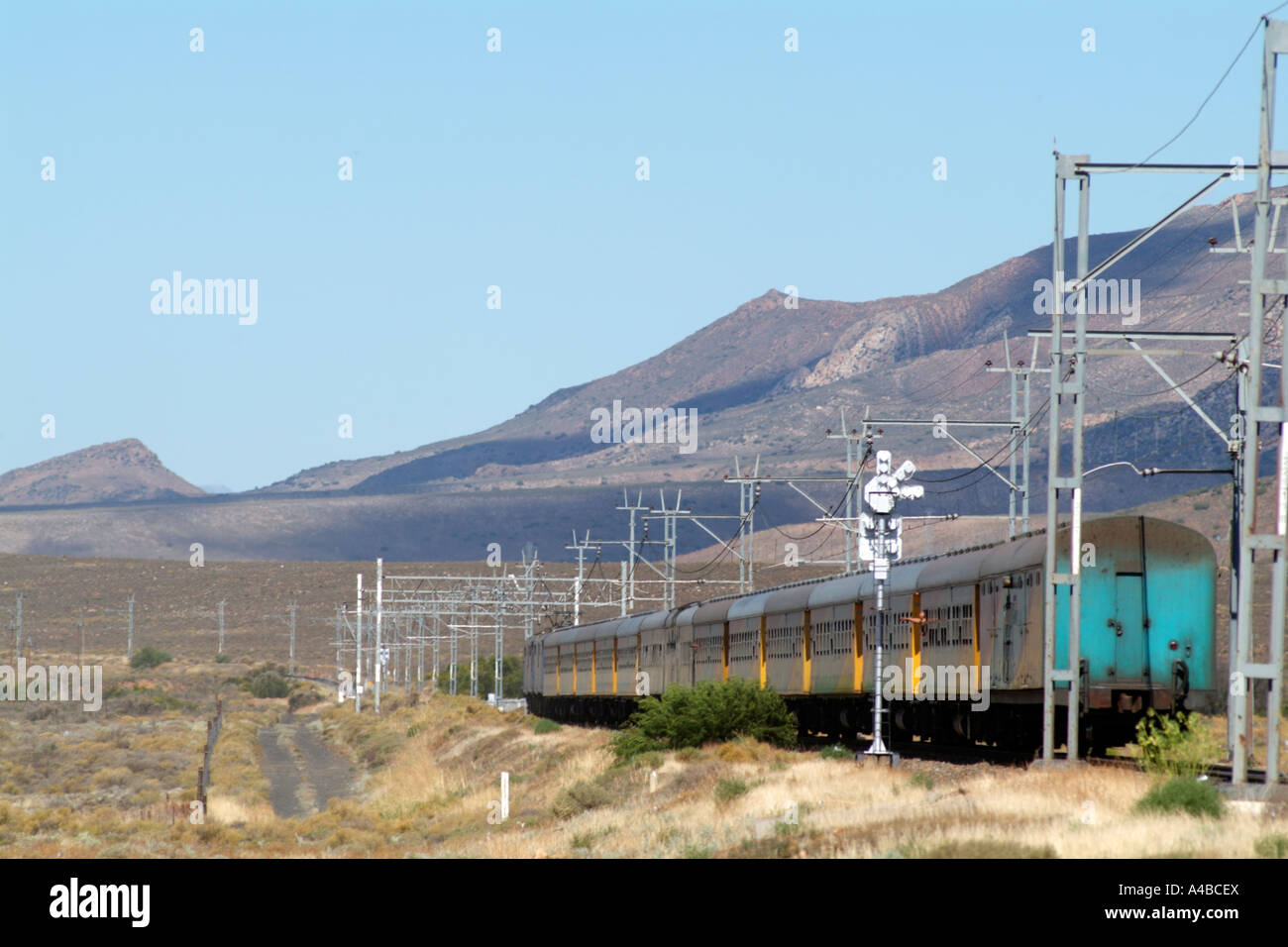 Electric powered railway train departing Matjiesfontein in the Karoo ...