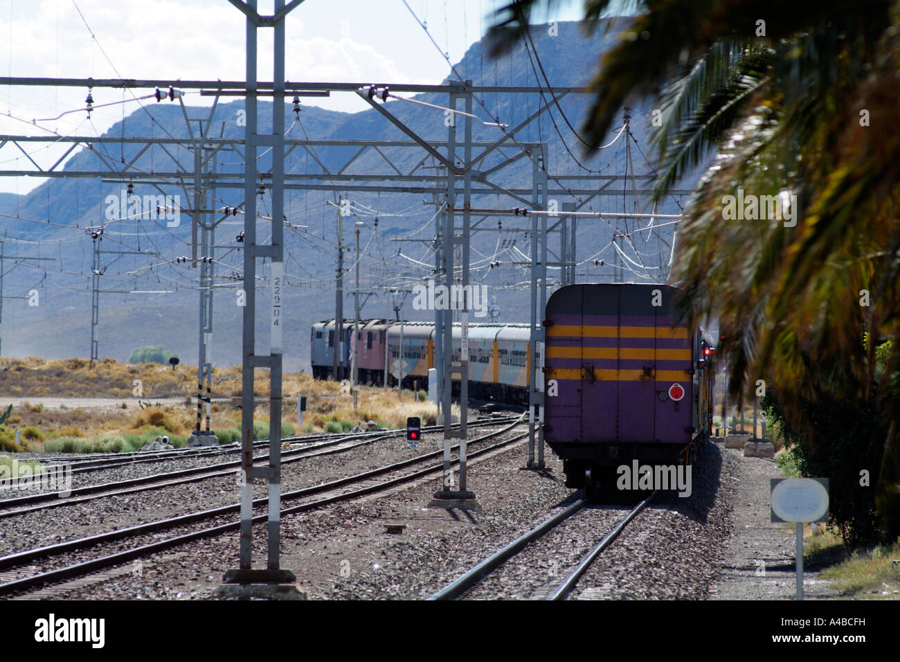 Electric powered railway train departing Matjiesfontein in the Karoo ...
