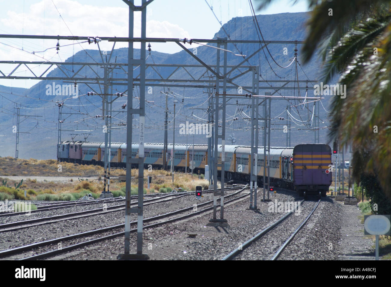 Electric powered railway train departing Matjiesfontein Station in the ...
