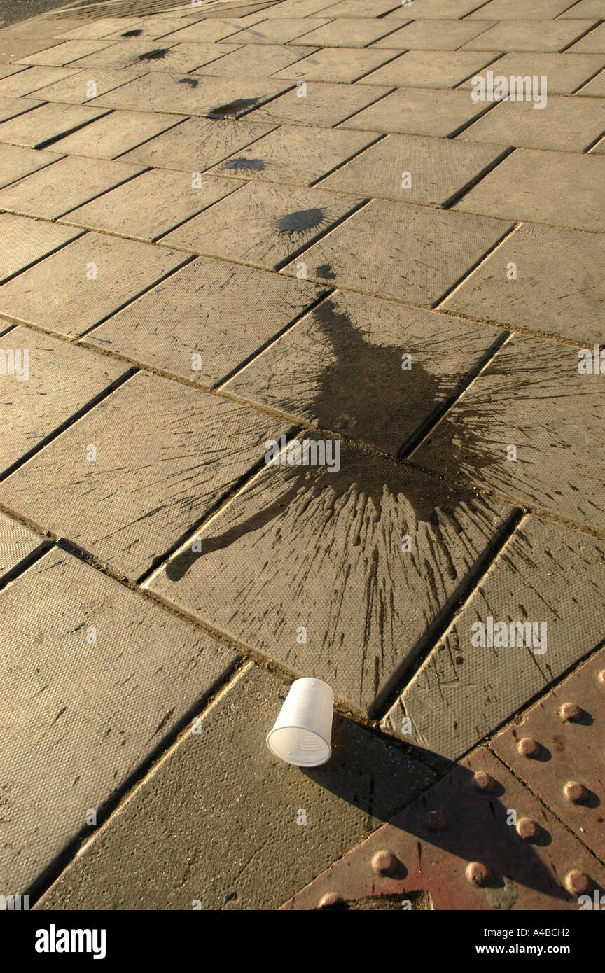 cup of water spilled on the pavement Stock Photo - Alamy