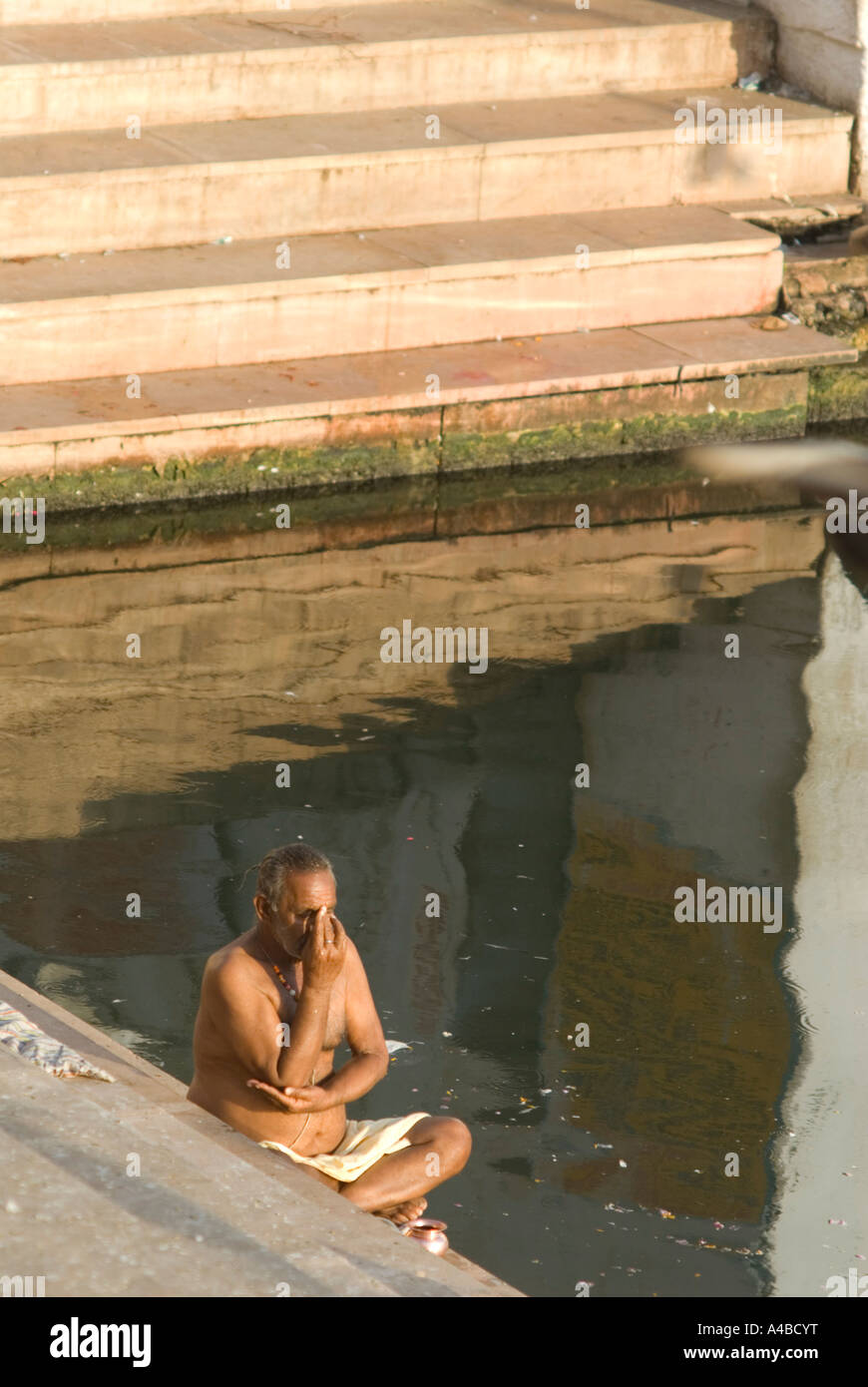 Stock image of Hindu man taking a ritual bath in Pushkar Rajasthan ...
