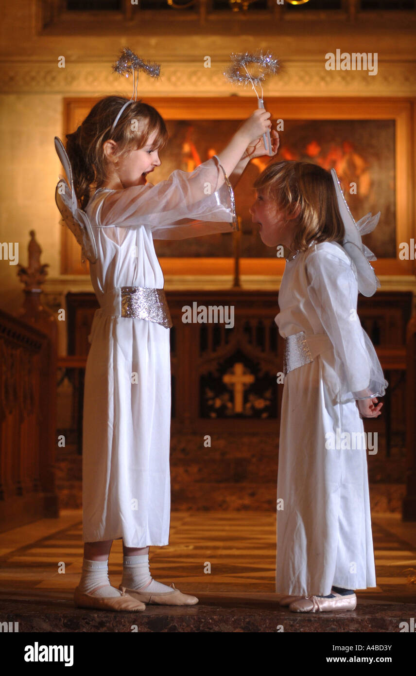 ANGELS PUTTING ON THEIR HALOS BEFORE A PRIMARY SCHOOL NATIVITY PLAY IN ...
