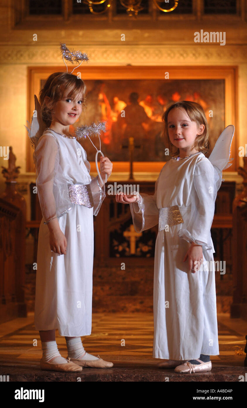 ANGELS PUTTING ON THEIR HALOS BEFORE A PRIMARY SCHOOL NATIVITY PLAY IN ...
