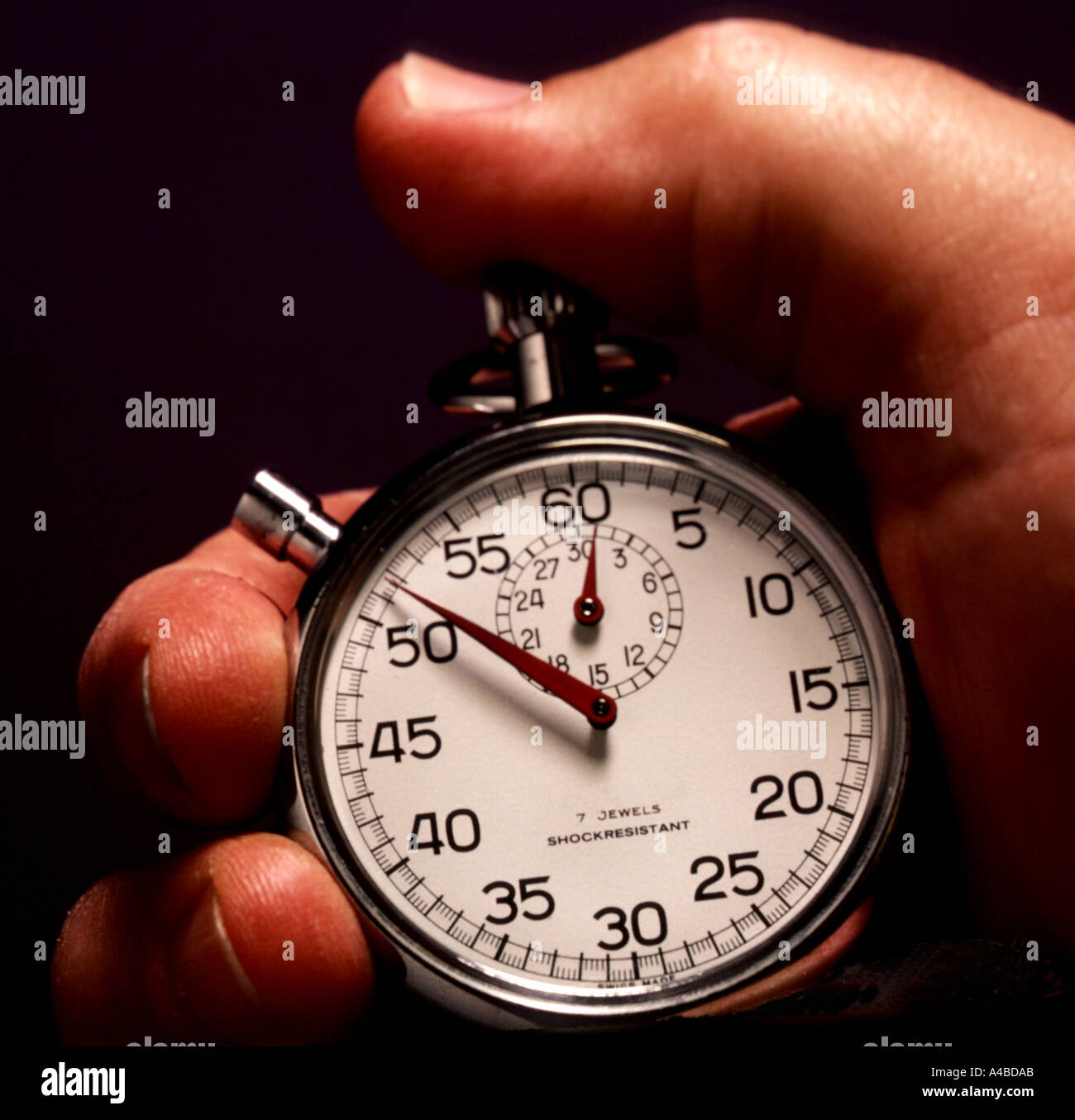 Hand holding stopwatch Stock Photo - Alamy