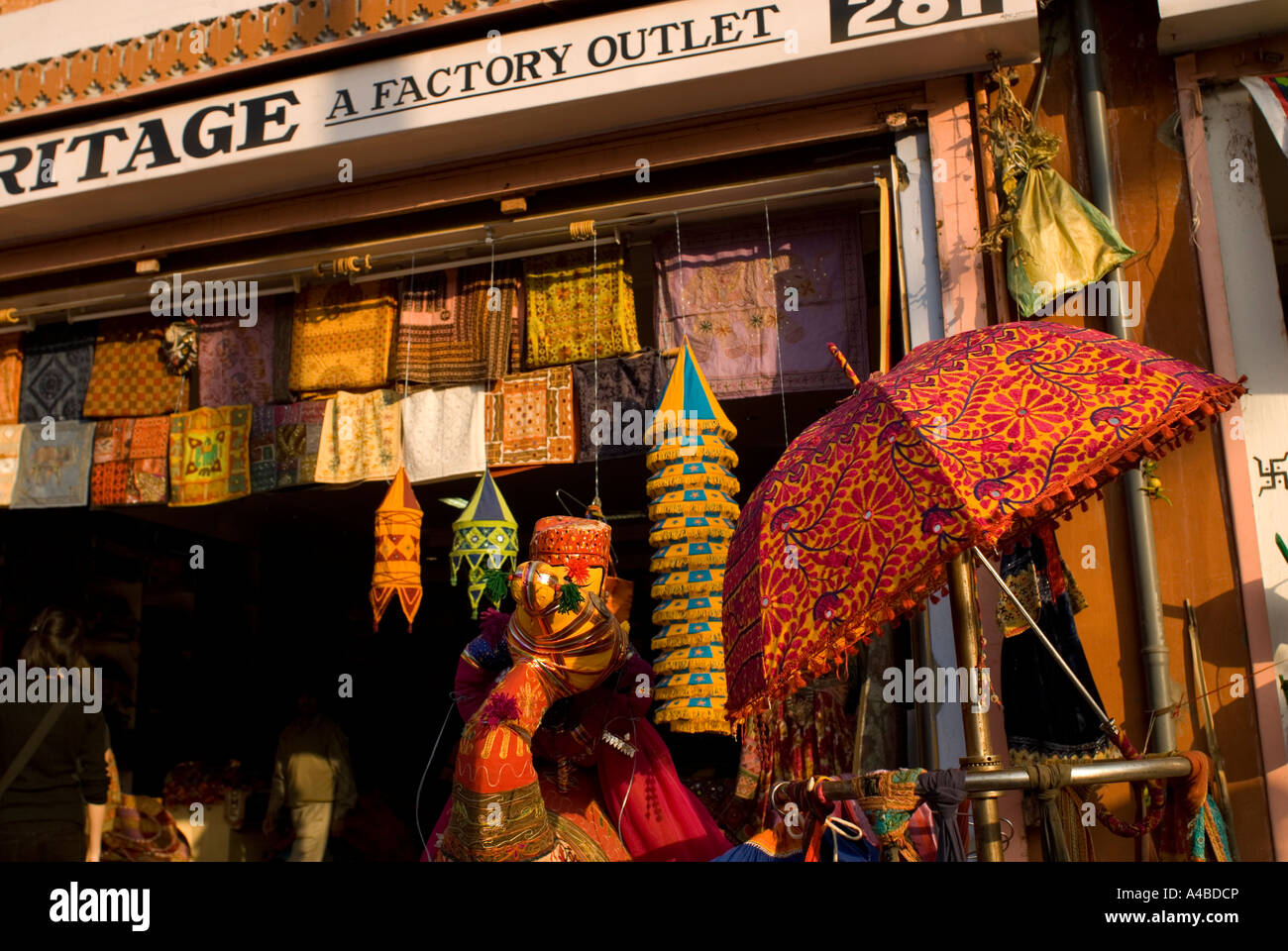 Stock image of colorful Indian shops with textiles for sale at sunset ...