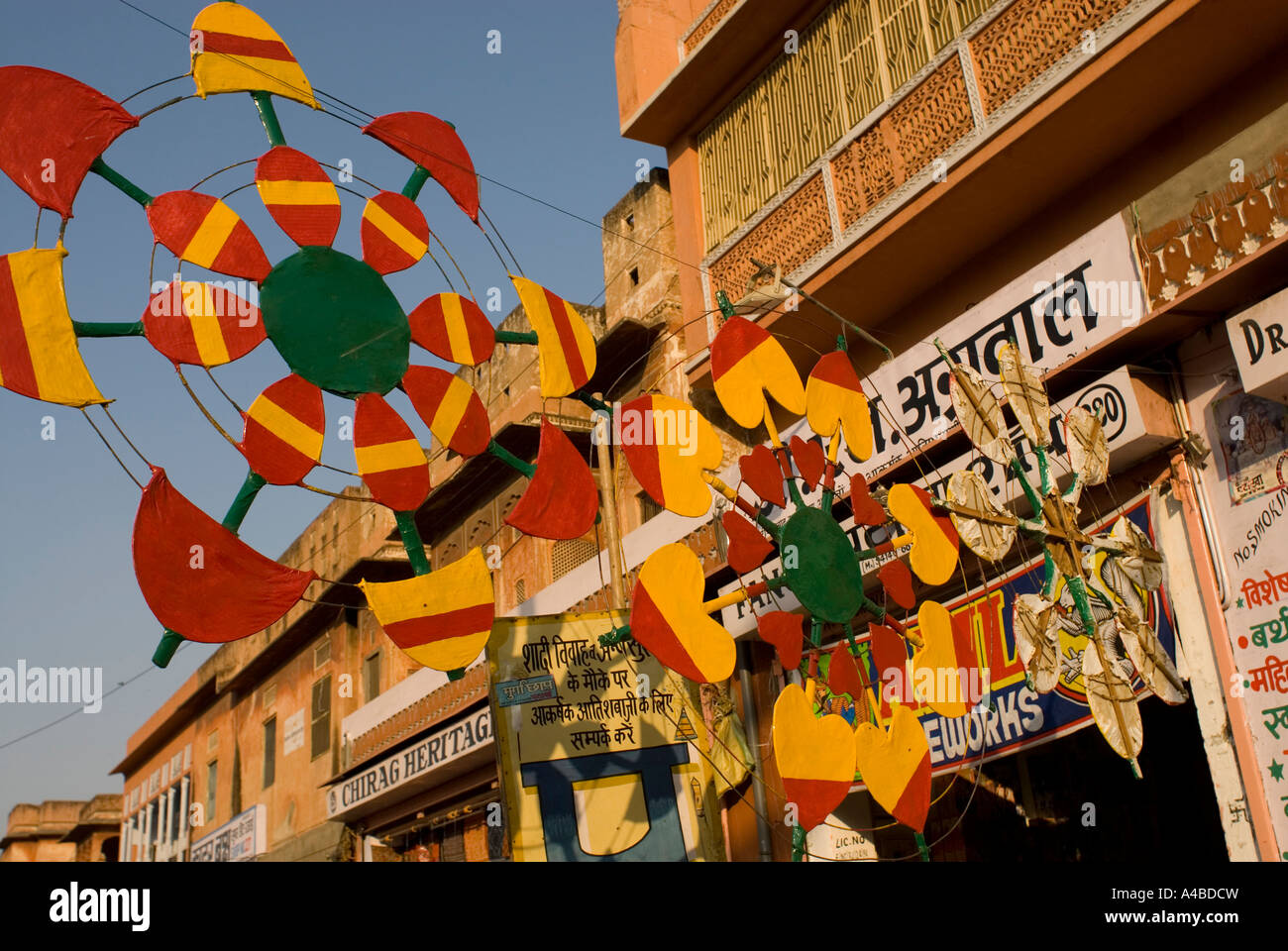 Stock image of colorful Indian shops with textiles for sale at sunset ...