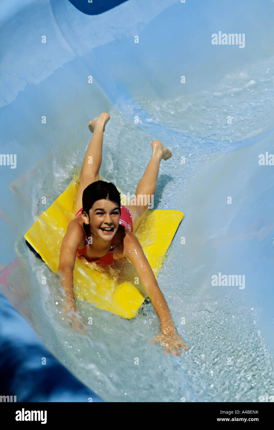 Girl on water slide hi-res stock photography and images - Alamy
