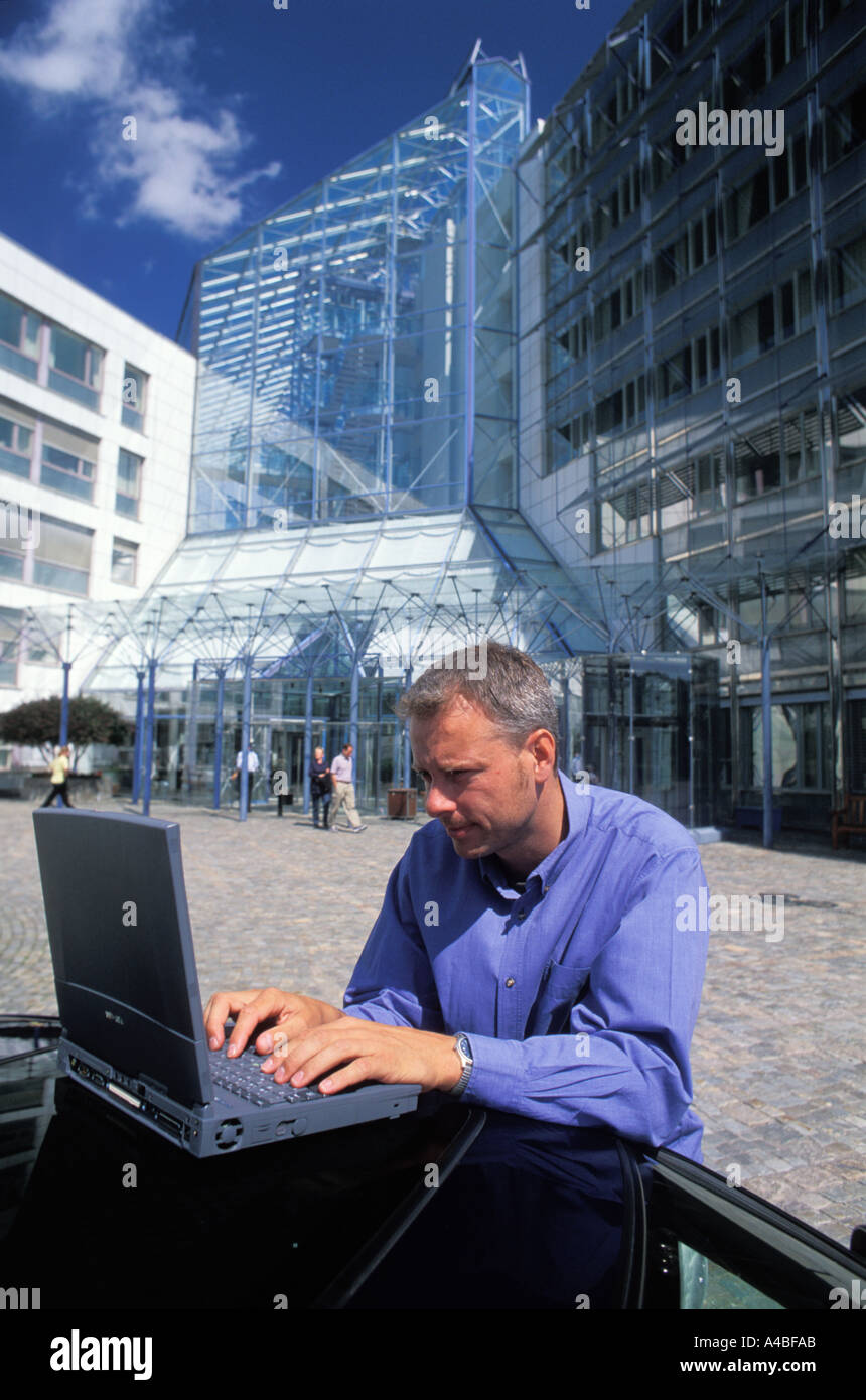 BUSINESS MAN WITH A LAPTOP MODEL RELEASED Stock Photo - Alamy