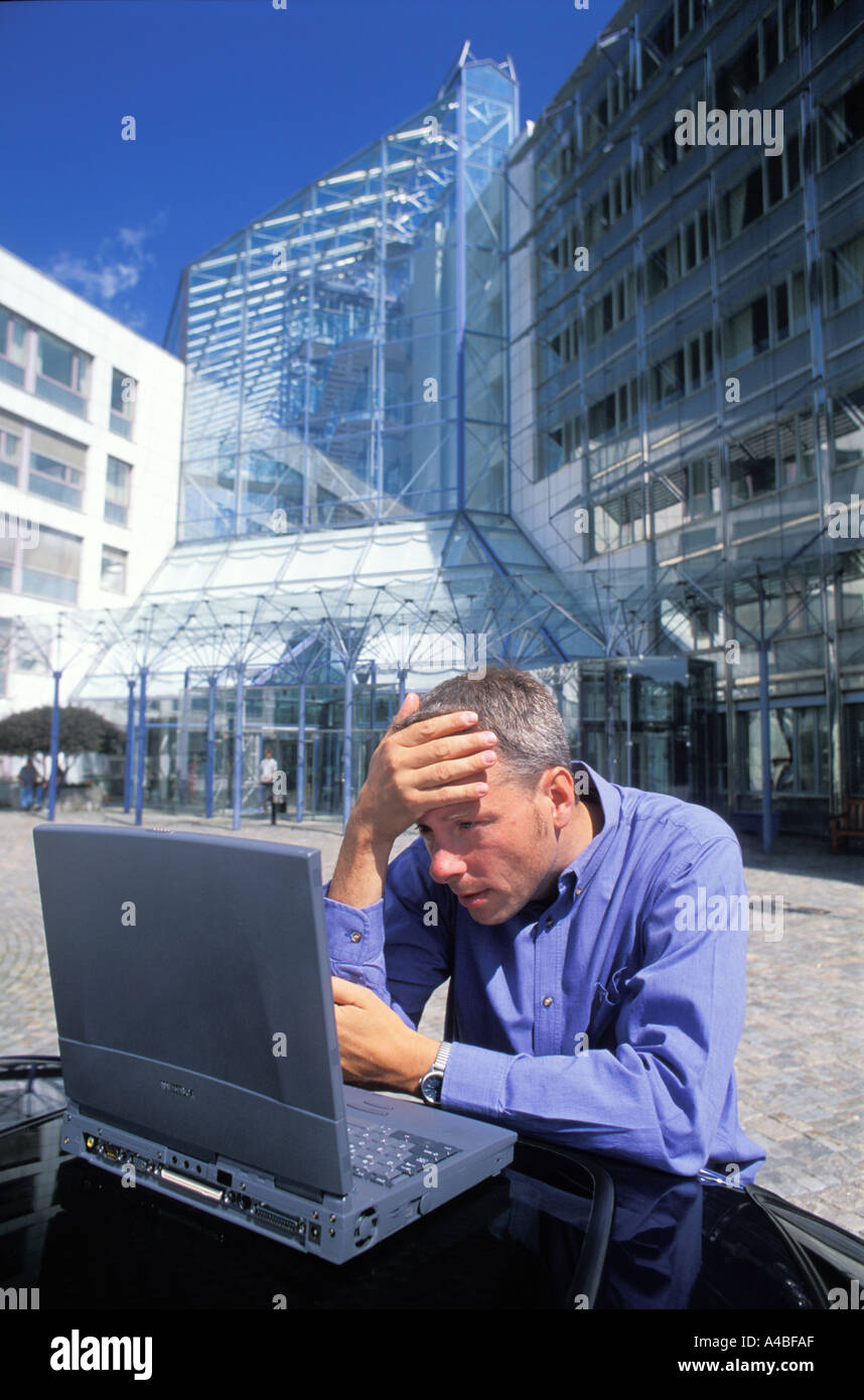 BUSINESS MAN WITH A LAPTOP MODEL RELEASED Stock Photo - Alamy