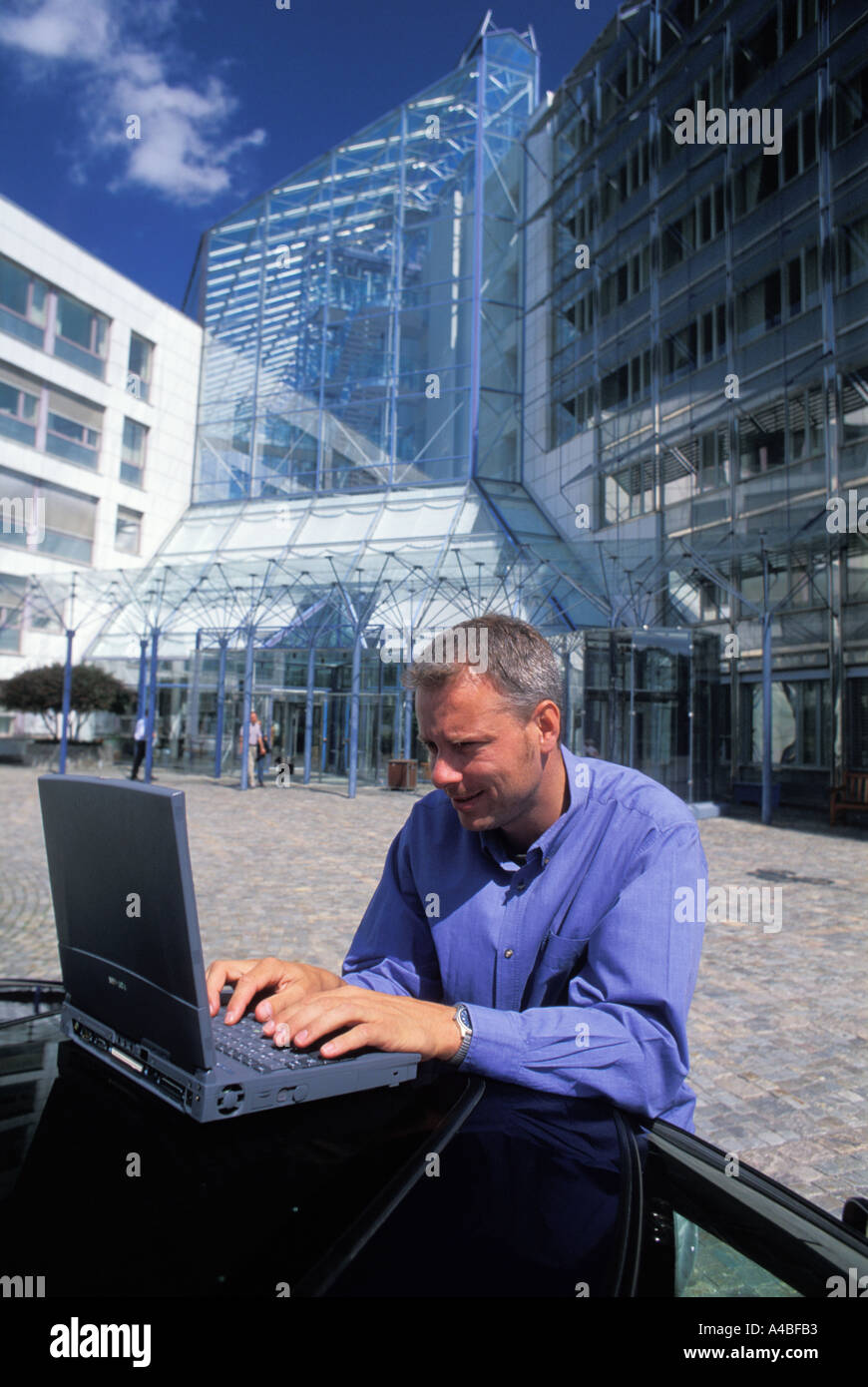 BUSINESS MAN WITH A LAPTOP MODEL RELEASED Stock Photo - Alamy