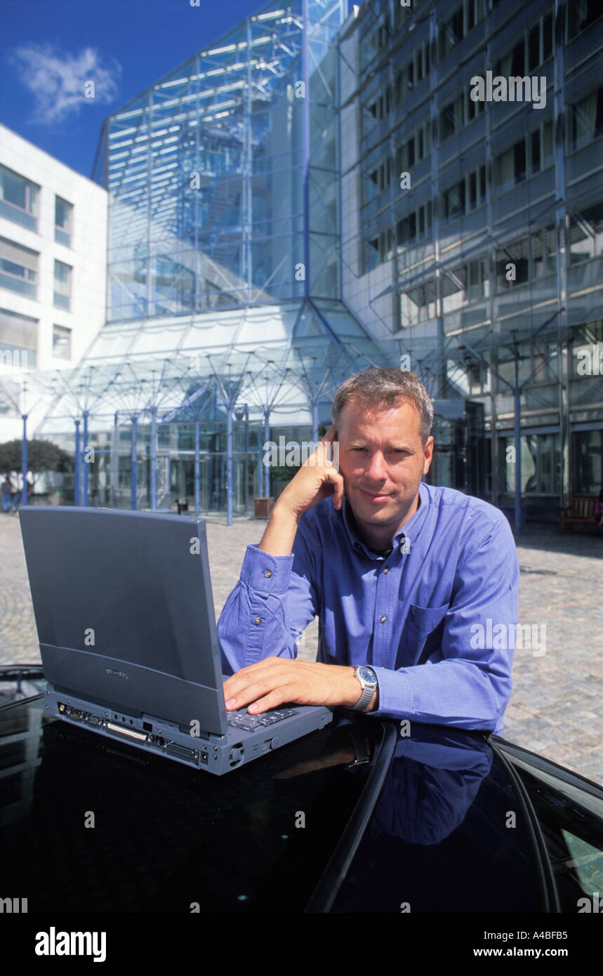 BUSINESS MAN WITH A LAPTOP MODEL RELEASED Stock Photo - Alamy