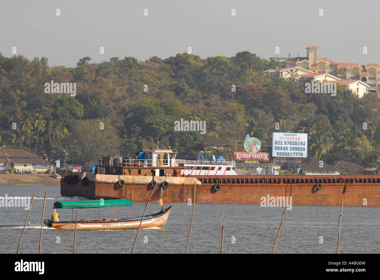 Stock image of barge and outboard on Mandovi Estuary at Panaji Goa ...