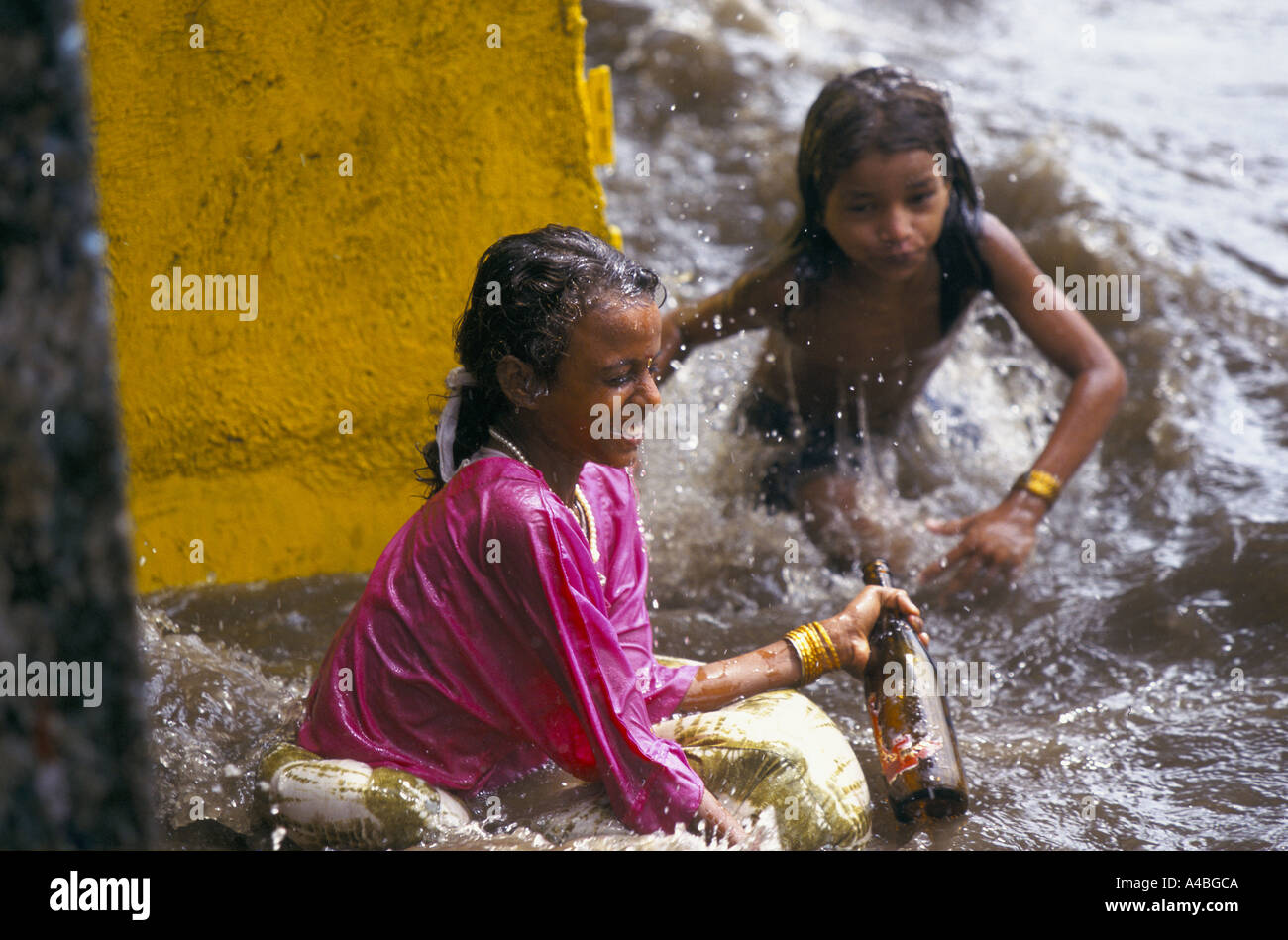 Children playing in rain monsoon hi-res stock photography and images ...