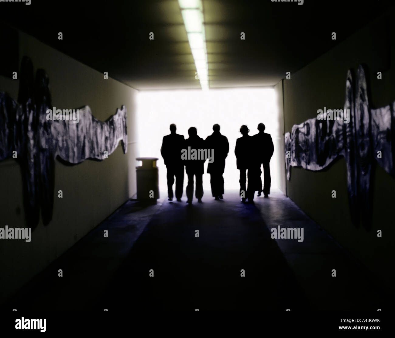 Menacing group of people walking into subway Cardiff Wales UK Stock ...