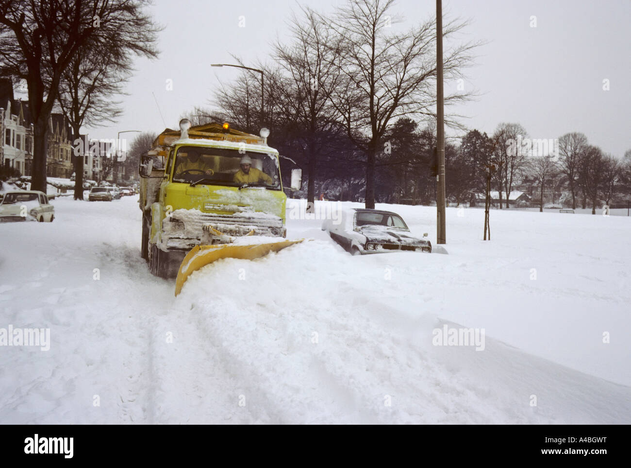 Snowplough clearing blocked street of snow Cardiff Wales UK Stock Photo ...