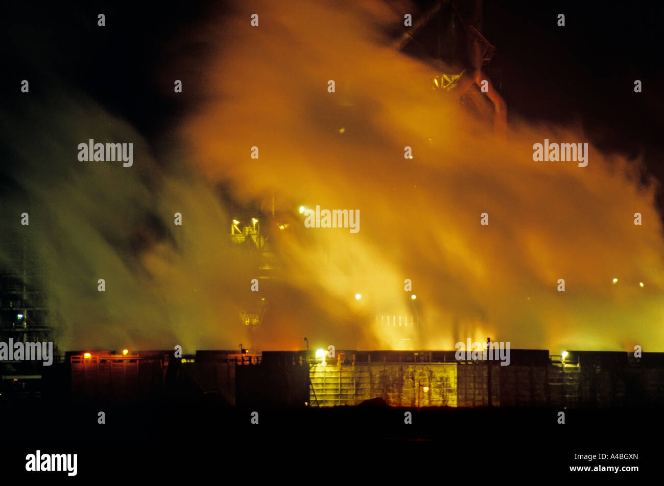 Smoke fumes rising from floodlit hi-res stock photography and images ...