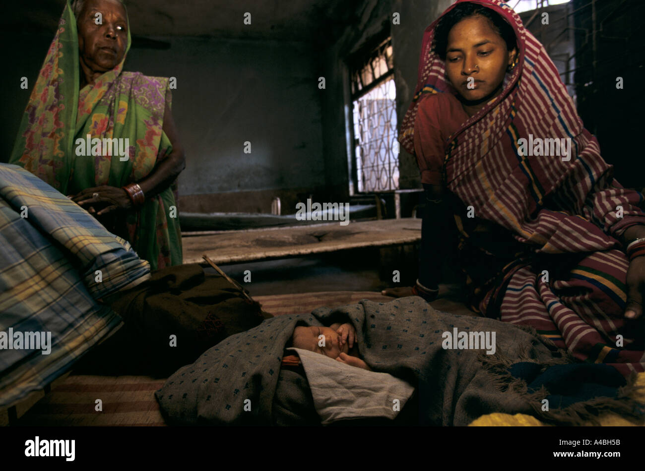 Orissa Cyclone, India, 1999 : this mother had just given birth. Her ...