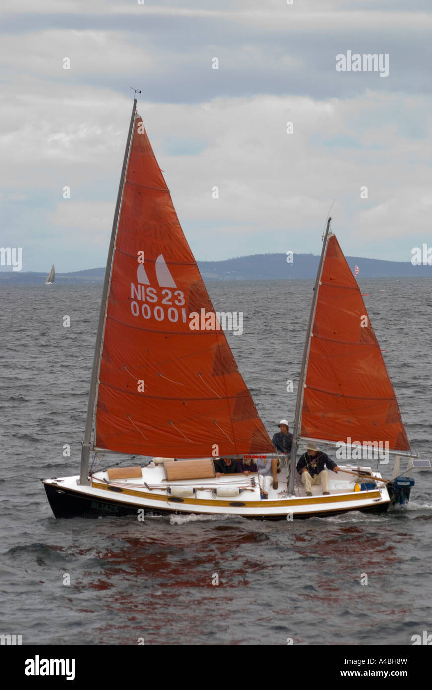 An open wooden sailing ketch on the Derwent River at Hobart during the ...