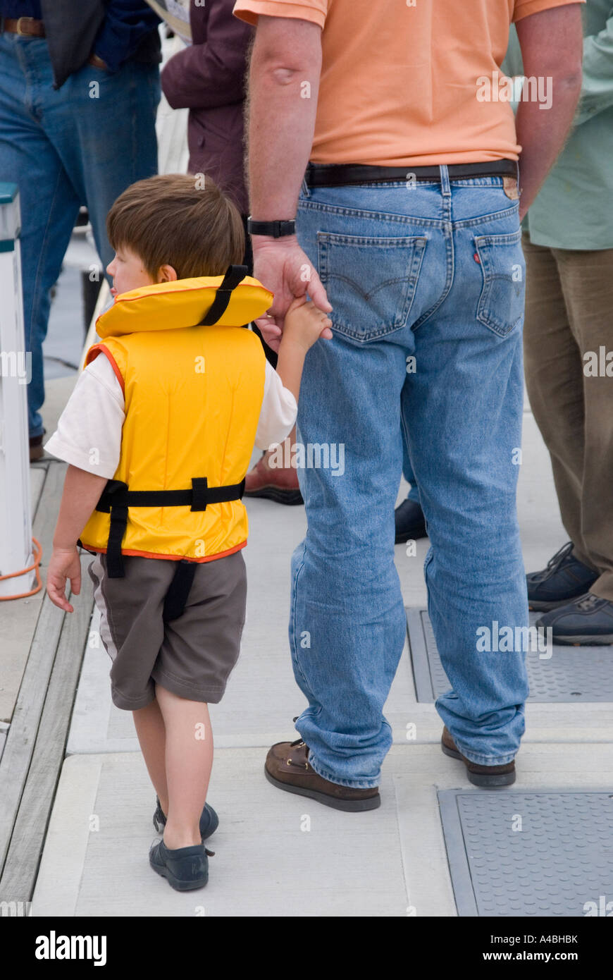 Boy wearing life jacket holding hi-res stock photography and images - Alamy