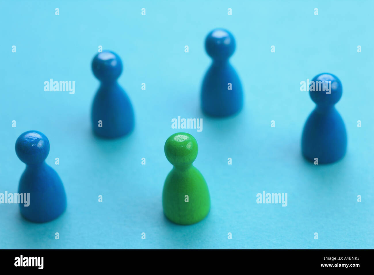 Pawns in a game on blue Stock Photo - Alamy