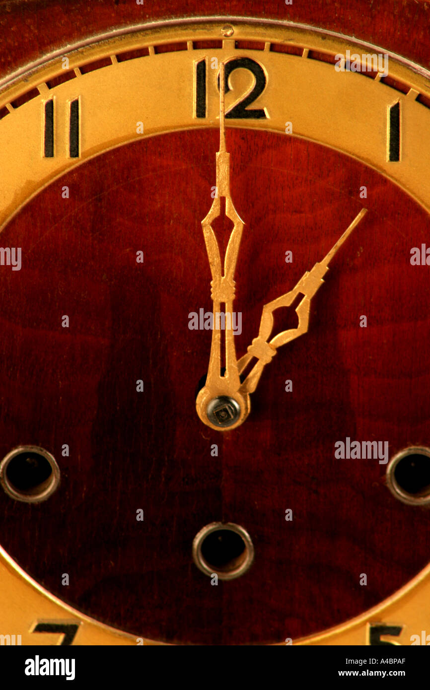 DPA98420 Old Clock close up showing time one clock two fingers concept ...