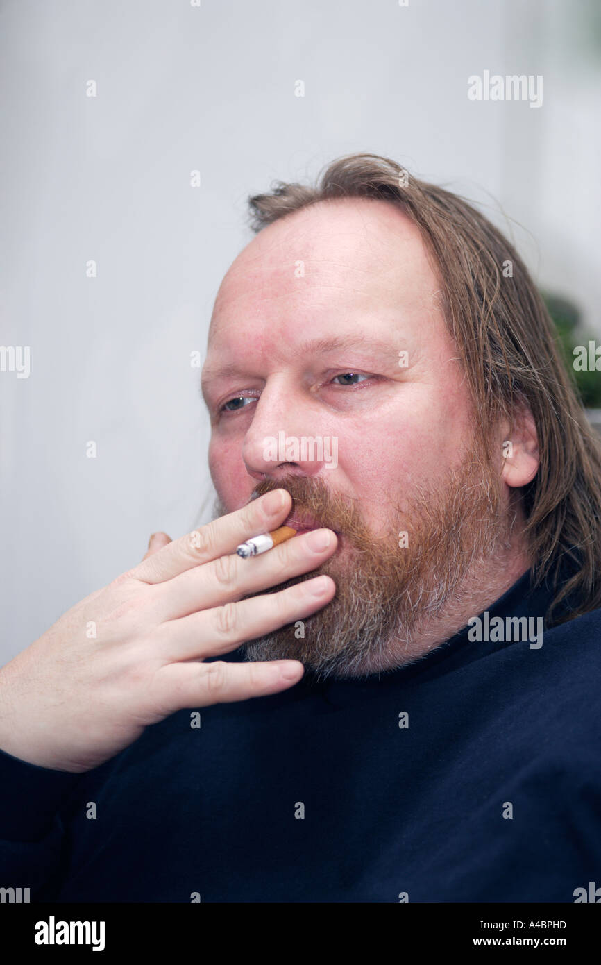 Overweight smoking hi-res stock photography and images - Alamy