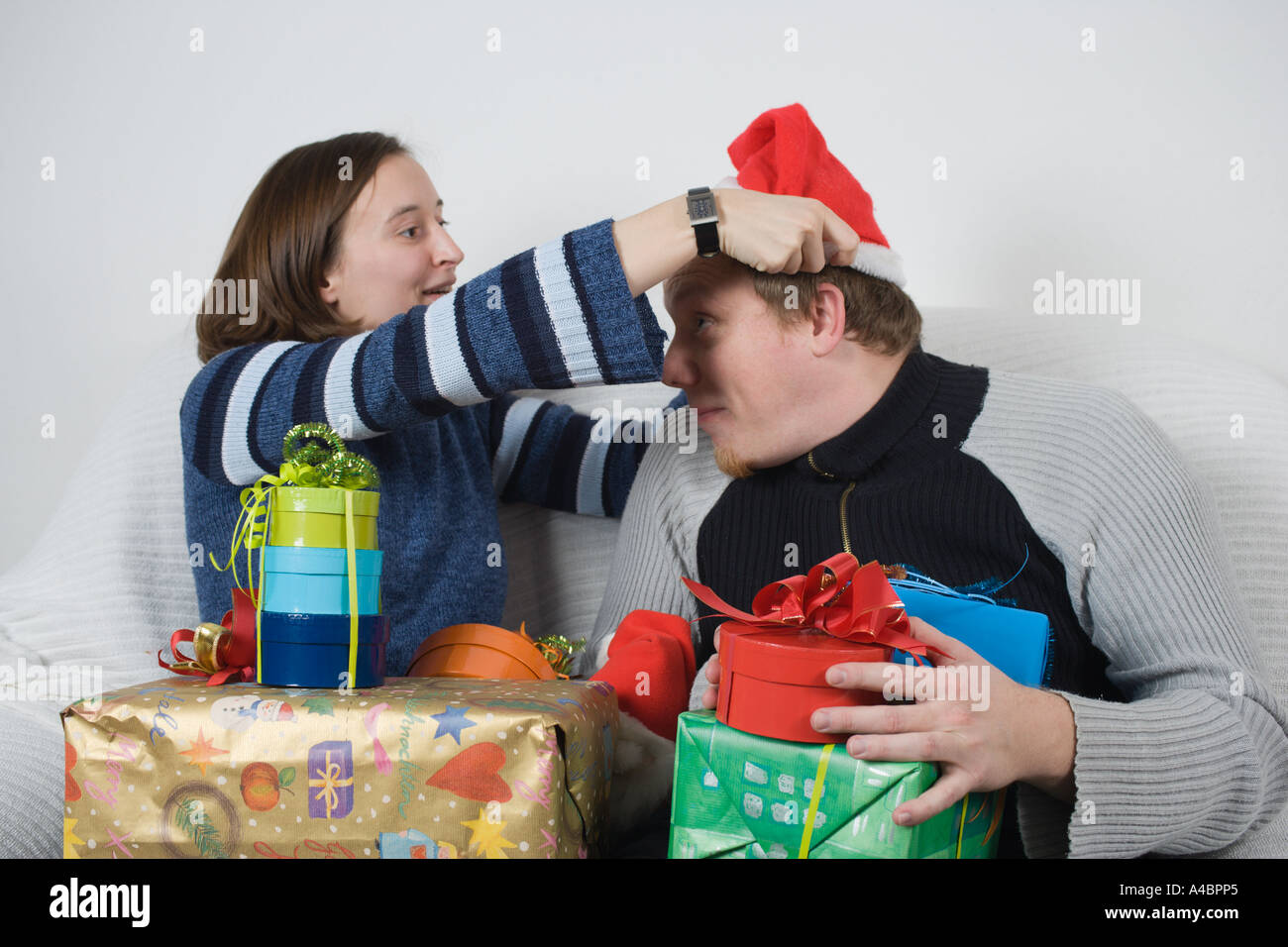 Woman putting santa claus hi-res stock photography and images - Alamy