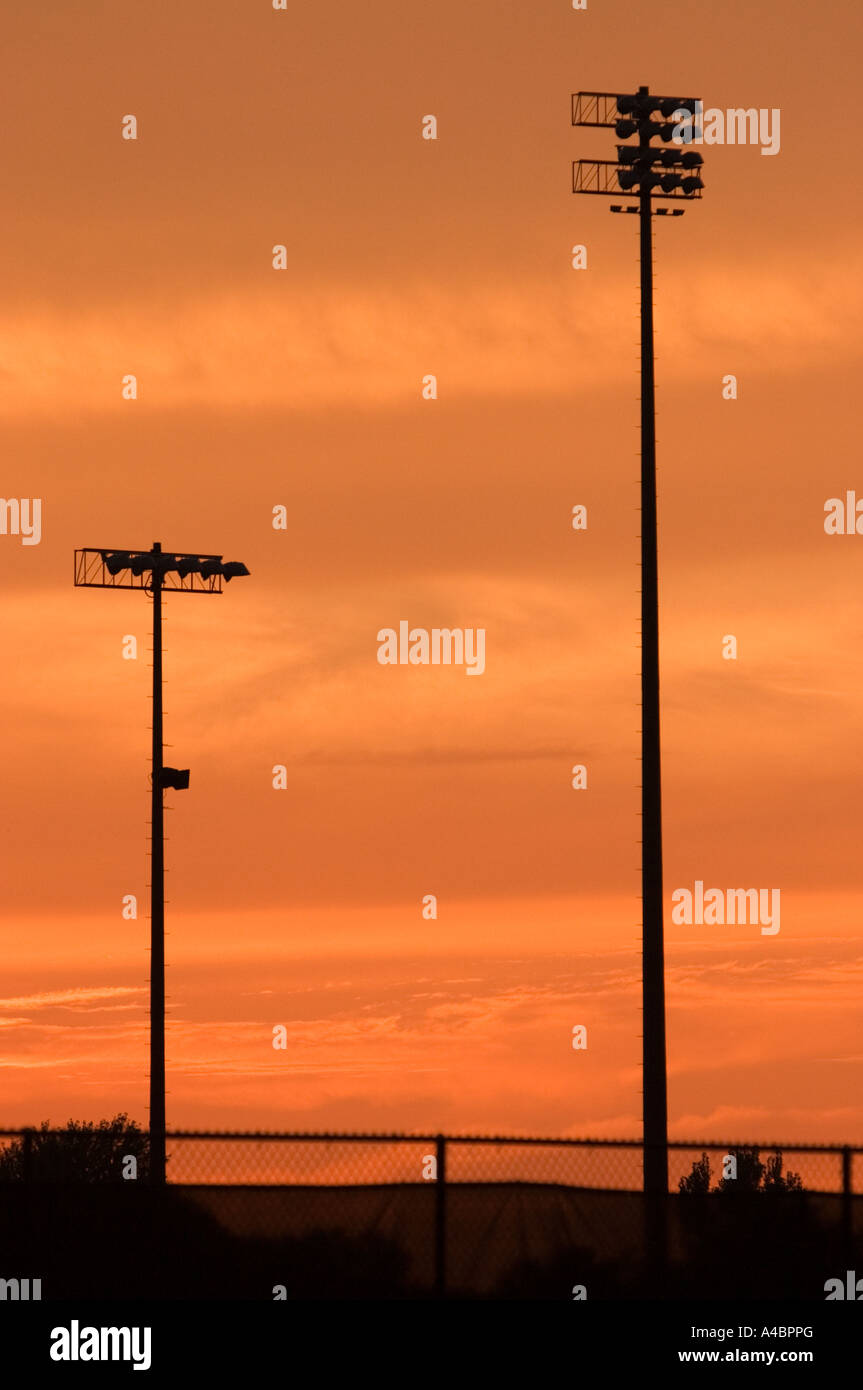 Stadium lights at sunset Stock Photo - Alamy