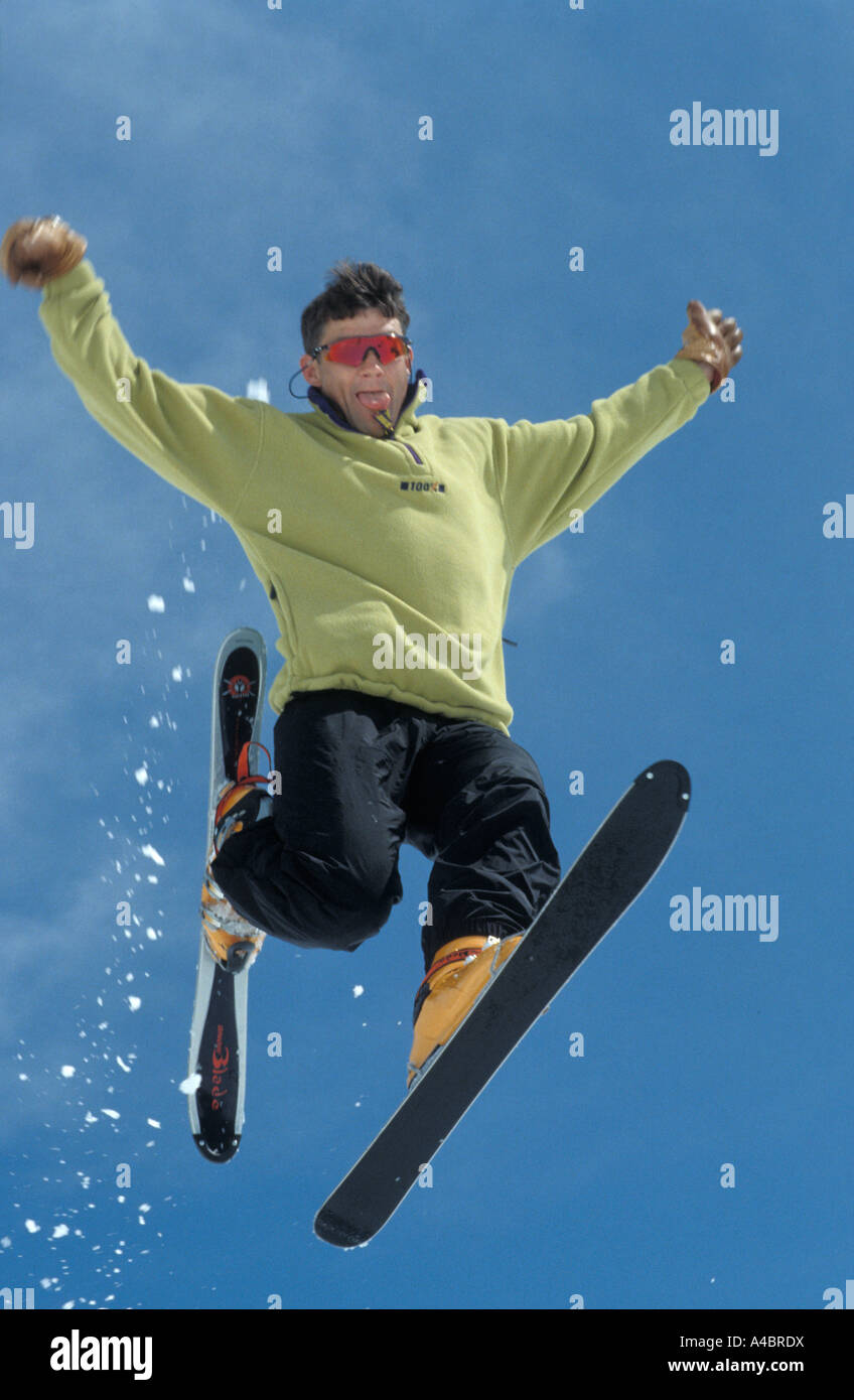 Skier jumping through the air on blades Stock Photo - Alamy