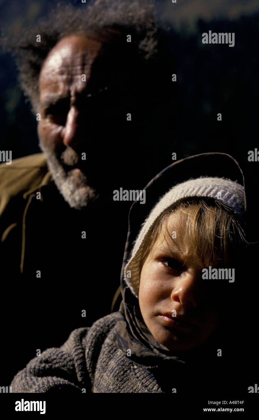 CHUBERI PASS, GEORGIA, OCTOBER 1993: A father and his daughter rest as ...