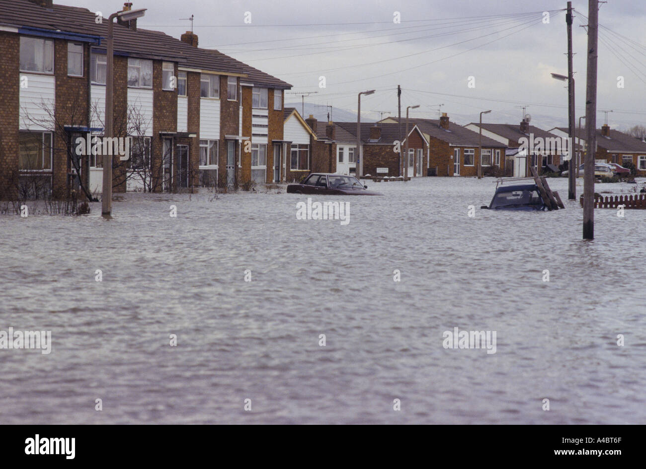 Waterlogged cars outside flooded houses after Hurricane winds cause the ...