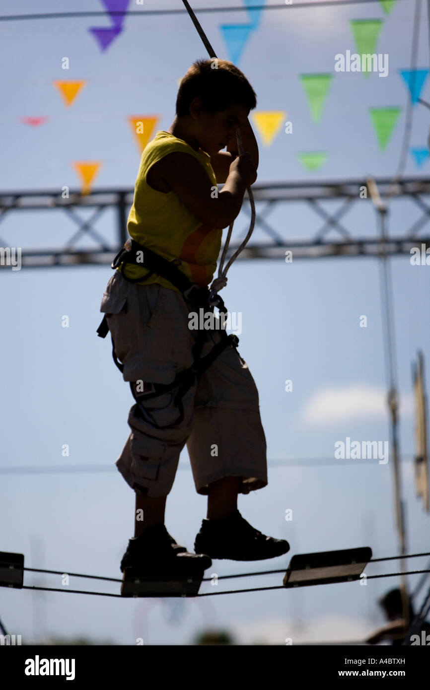 Silhouette of young boy walking along a tightrope, Bilbao, Basque ...