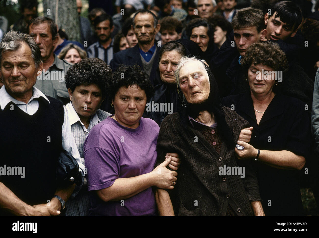 Comforted by a priest hi-res stock photography and images - Alamy