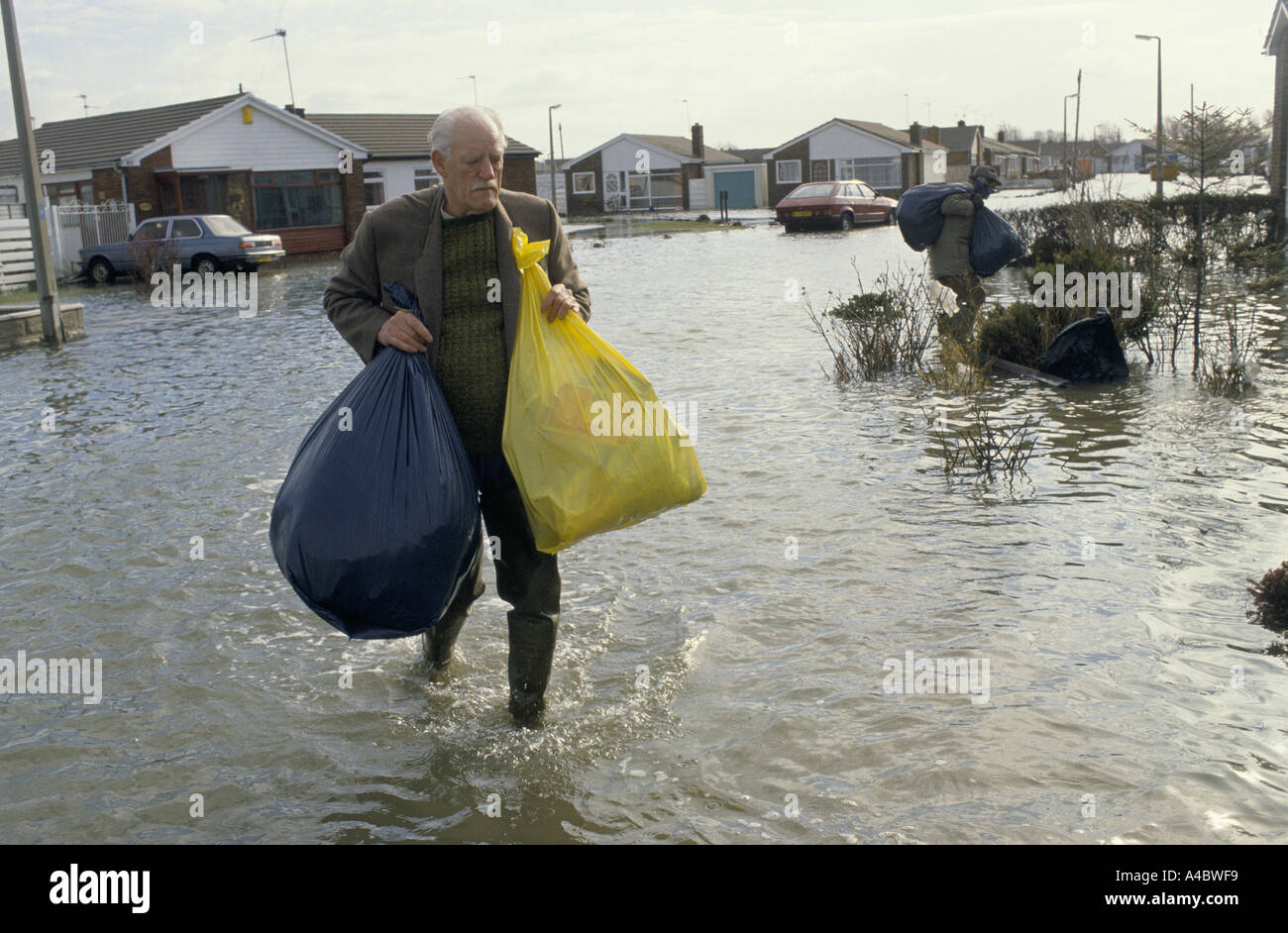 People resue belonging from their flooded houses after Hurricane winds ...