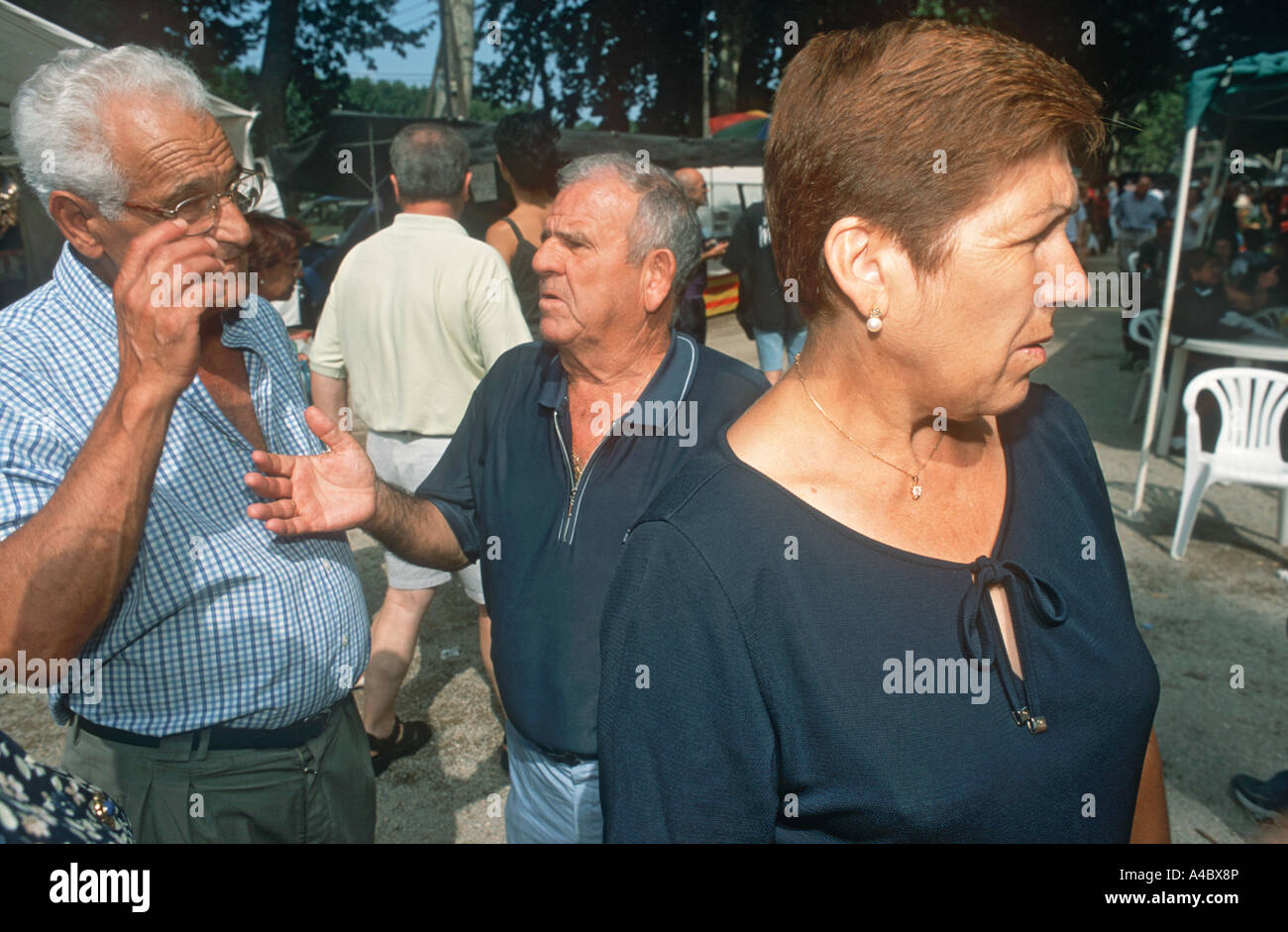 Two spanish men talking at a market in Gerona, Spain Stock Photo - Alamy