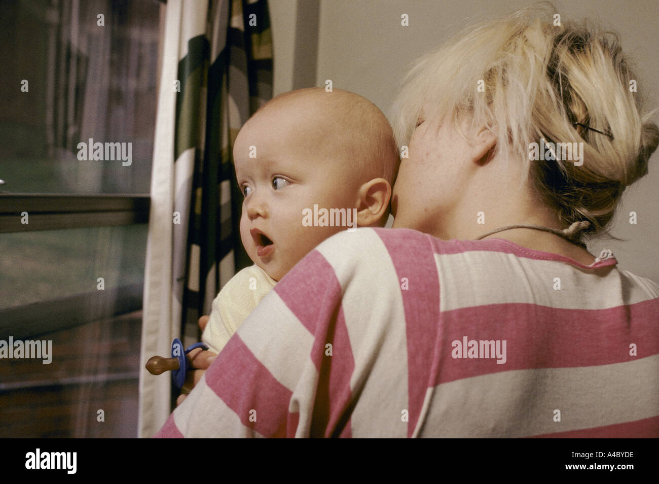 A prisoner holds her baby son Stock Photo - Alamy