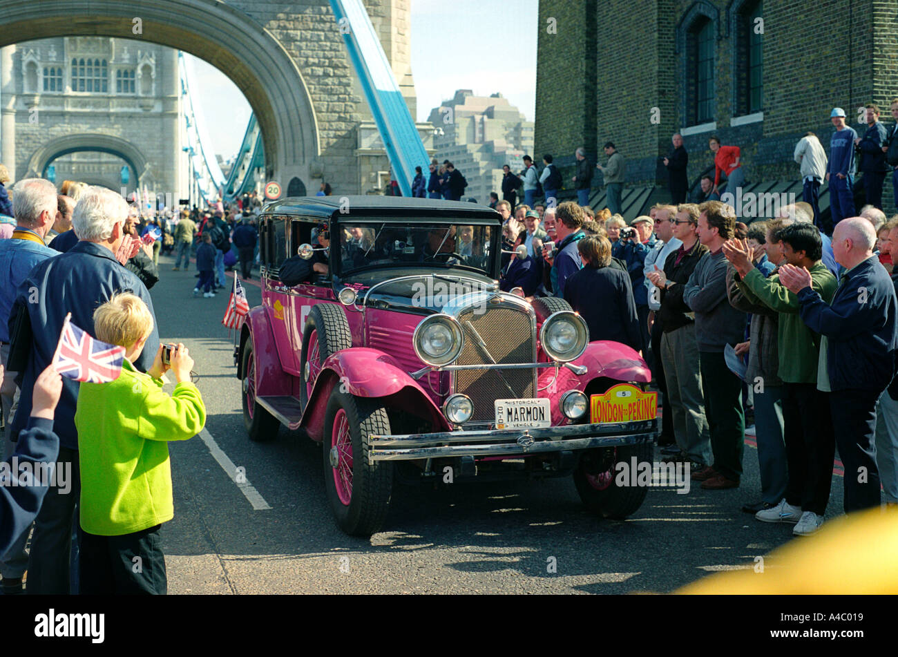 Classic car no 5 leaving Tower Bridge London UK at start of 2000 2001 ...