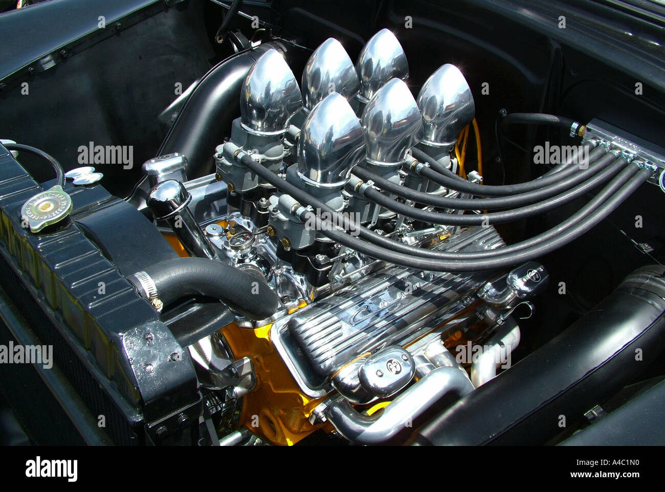 Engine intake carburater manifolds on hot rod Stock Photo - Alamy