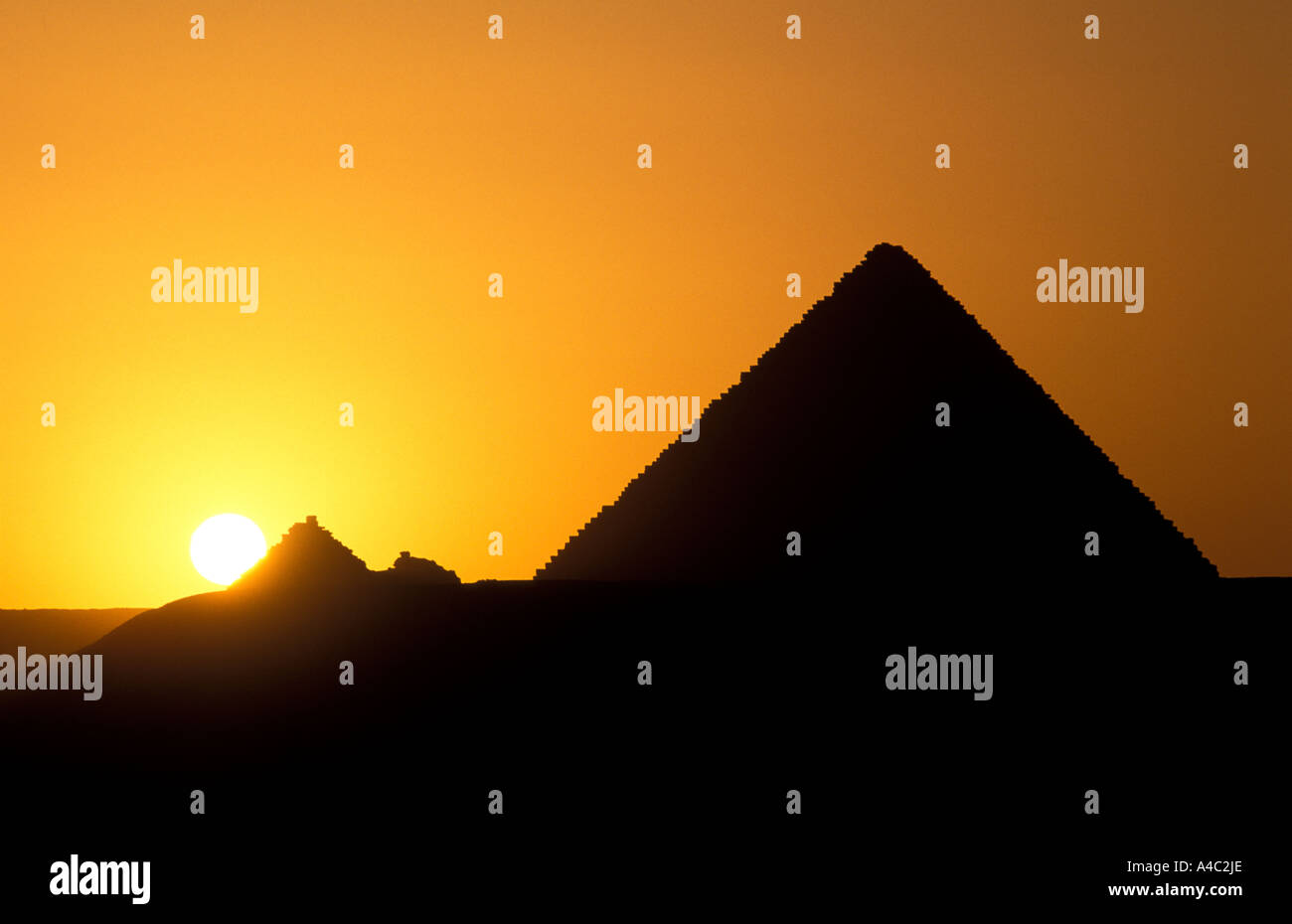 Silhouettes of the Great pyramids of Giza at sunset Cairo Egypt Stock ...