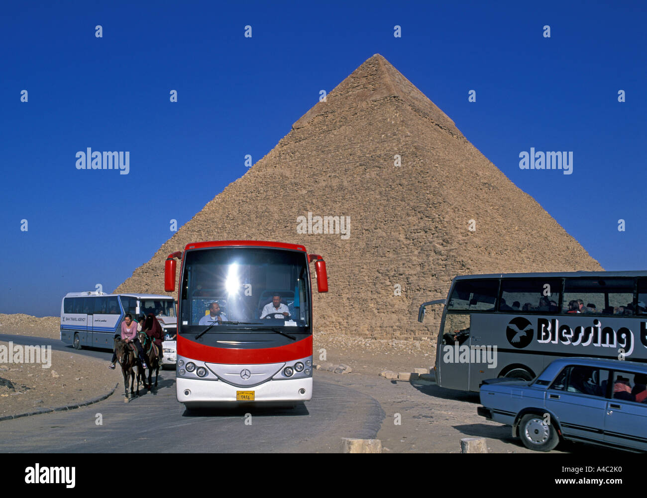 Tourists visiting the Great pyramids of Giza Egypt Stock Photo - Alamy