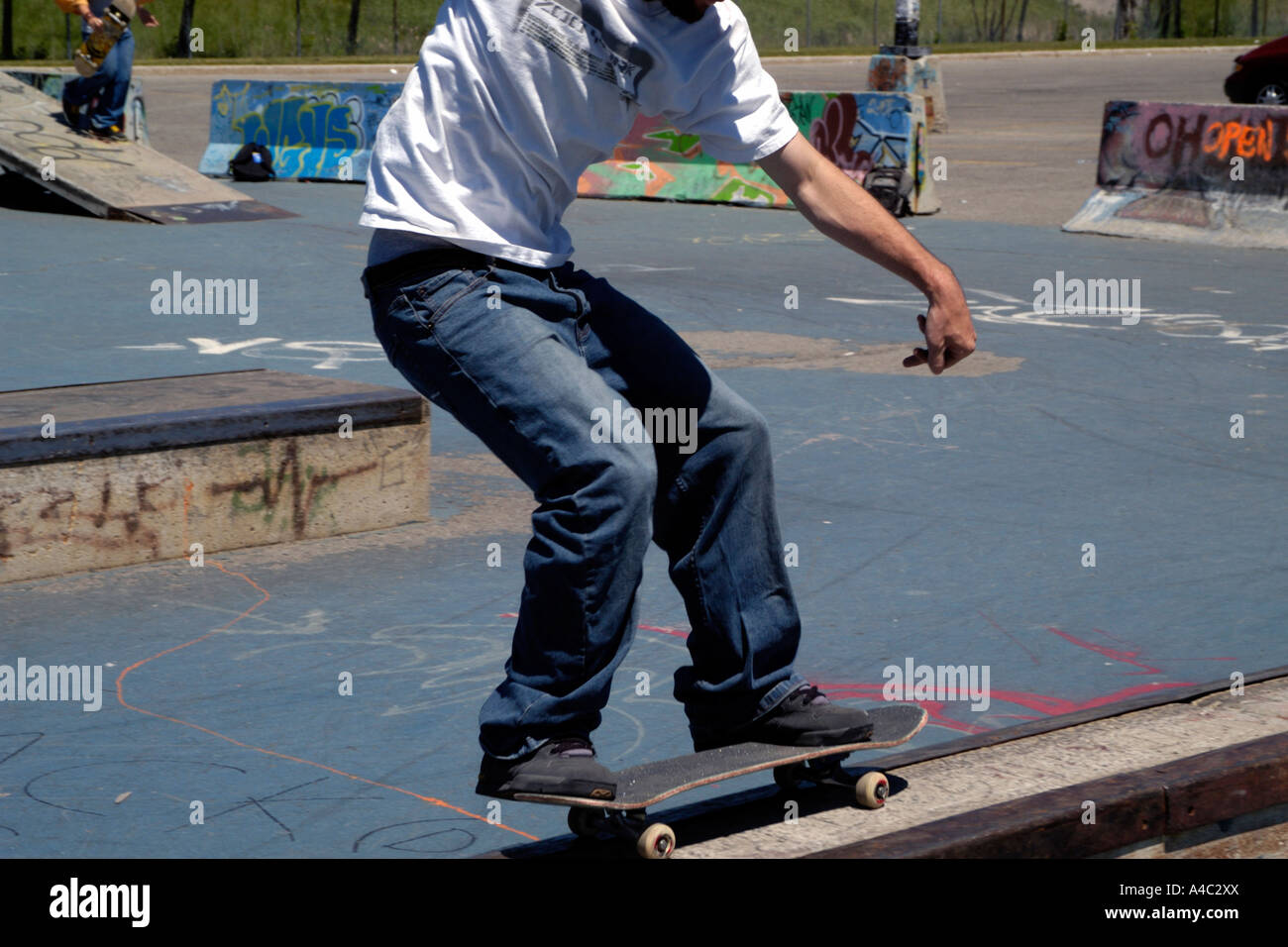 Skateboarder riding the rail Stock Photo - Alamy