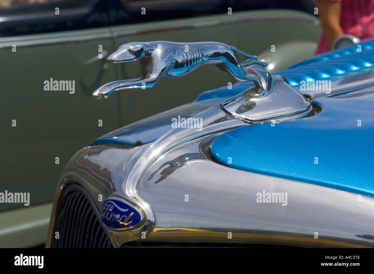 Classic Ford in metallic blue with Ford badge and chrome greyhound ...