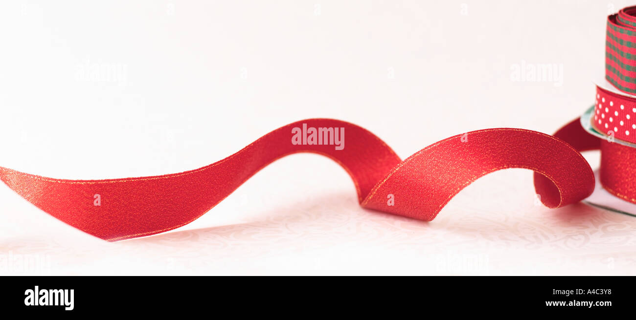 Red Ribbon Tail from Spool Stock Photo - Alamy
