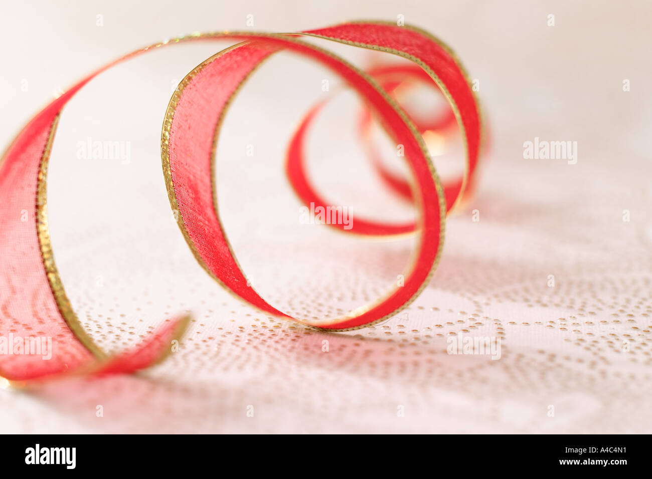 Sheer Red Ribbon Curl Stock Photo - Alamy