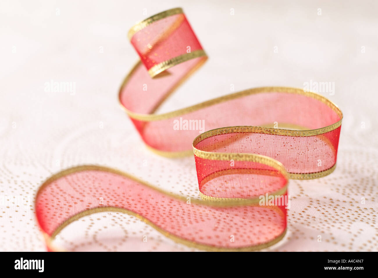 Sheer Red & Gold Ribbon Curl Stock Photo - Alamy